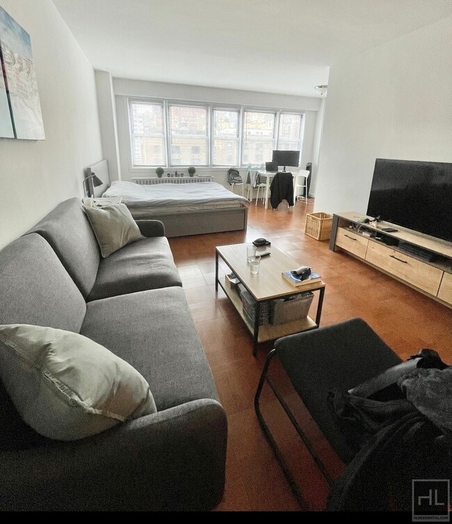 Fantastic Sunny Studio with wall of window... - 150 E 37th St New York ...