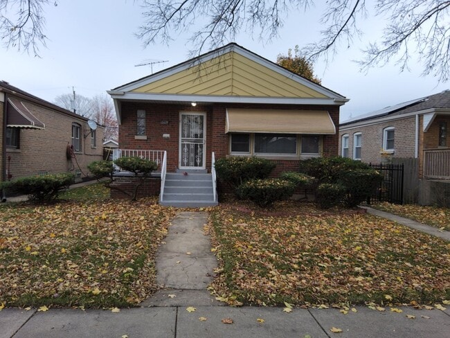 This stunning raised brick -ranch home sit... - 12639 S Stewart Ave ...